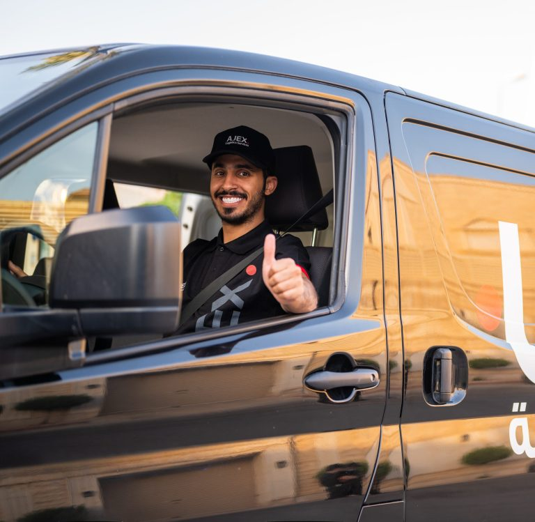 AJEX Courier guy inside the AJEX Van